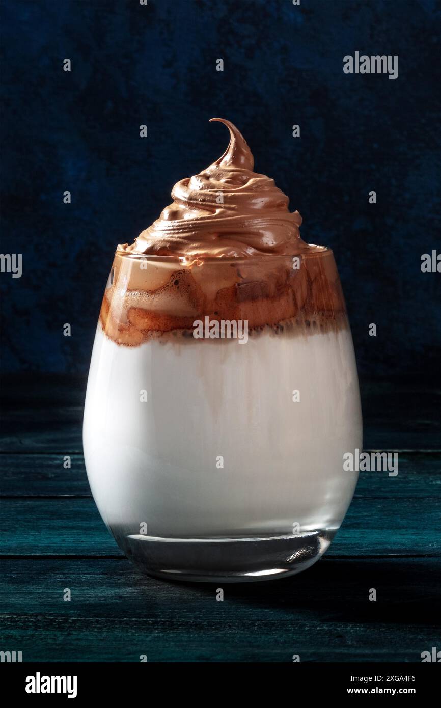 Dalgona cold coffee on a dark background. Korean beverage with instant ...