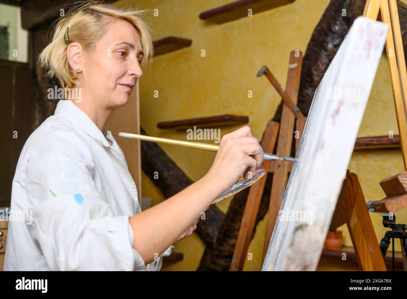 Woman artist draws picture using hi-res stock photography and images ...