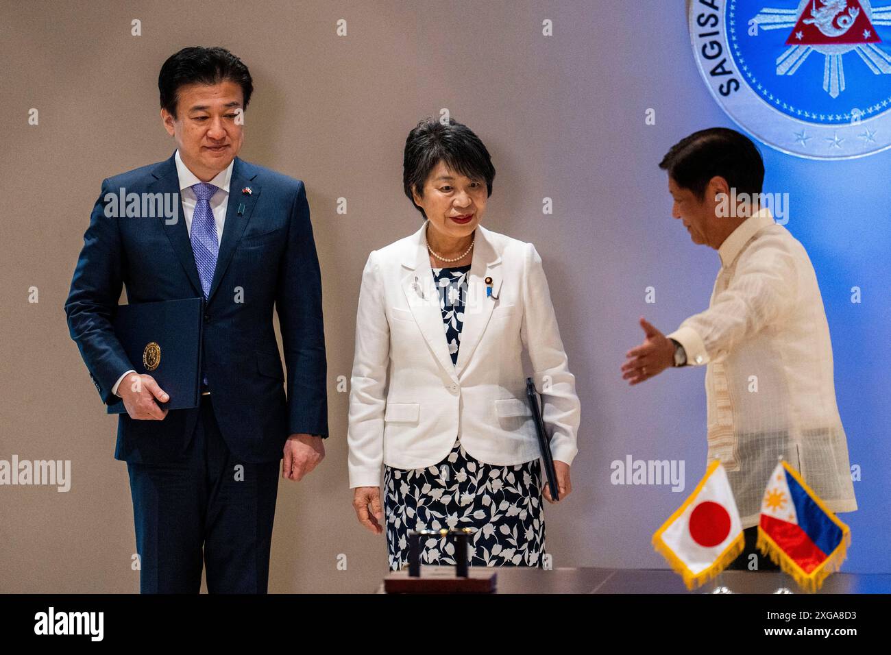 Philippine President Ferdinand Marcos Jr., right, gestures as he speaks ...