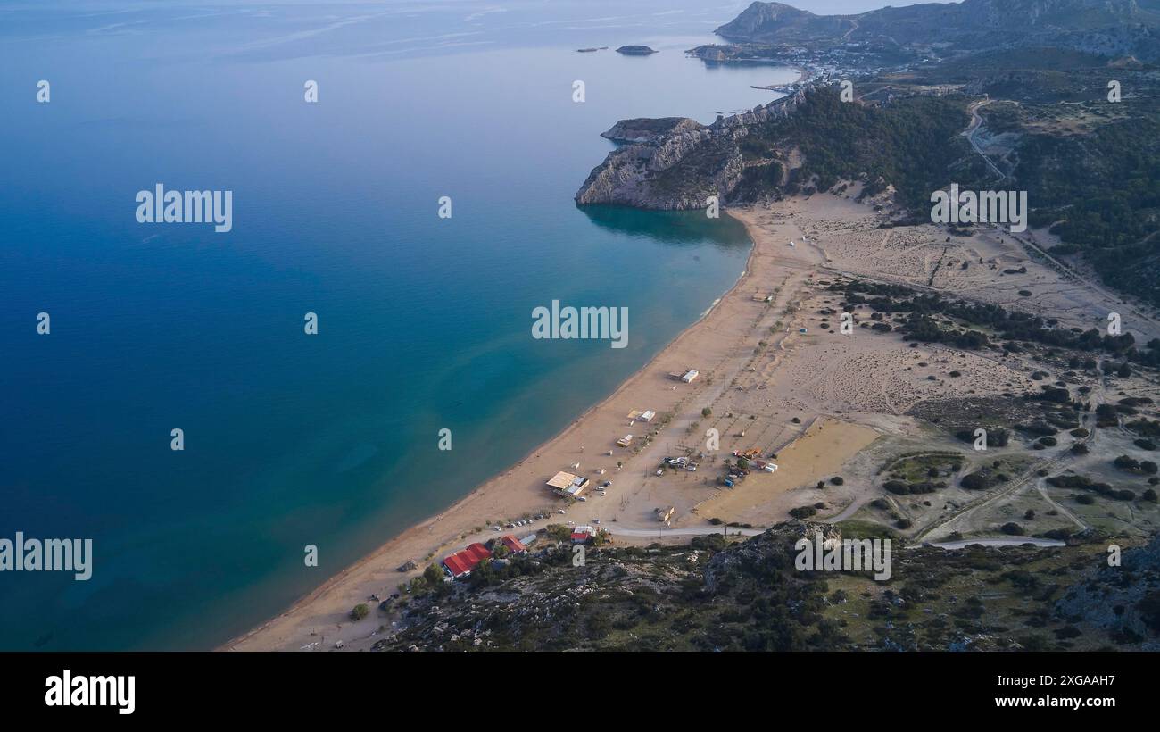 Aerial view of a secluded sandy beach landscape with clear blue water ...