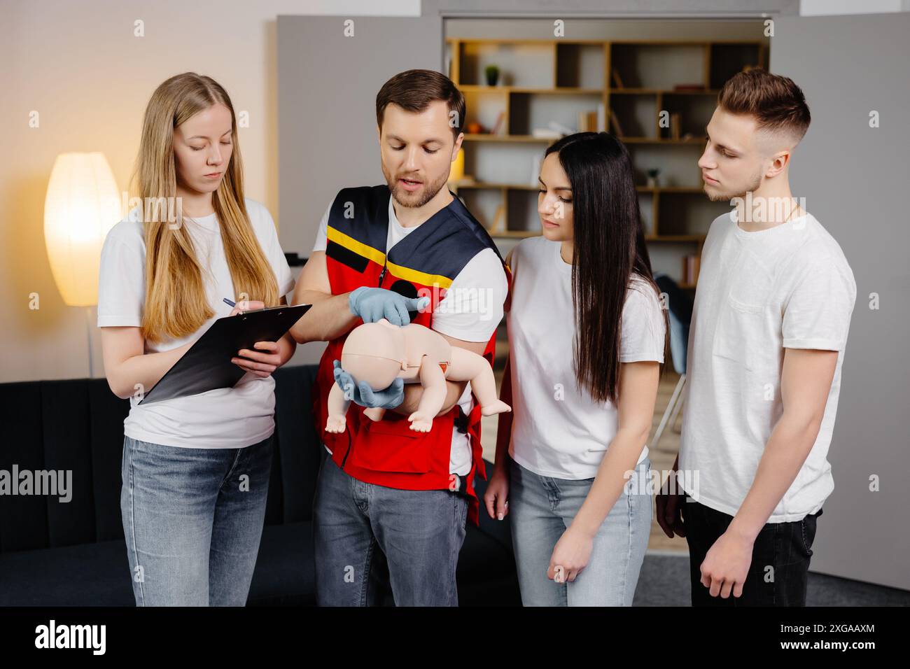 Group of people learning how to make first aid with dummy child during ...