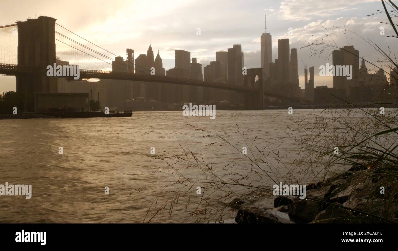Brooklyn Bridge, rainy foggy day. New York City Manhattan downtown ...