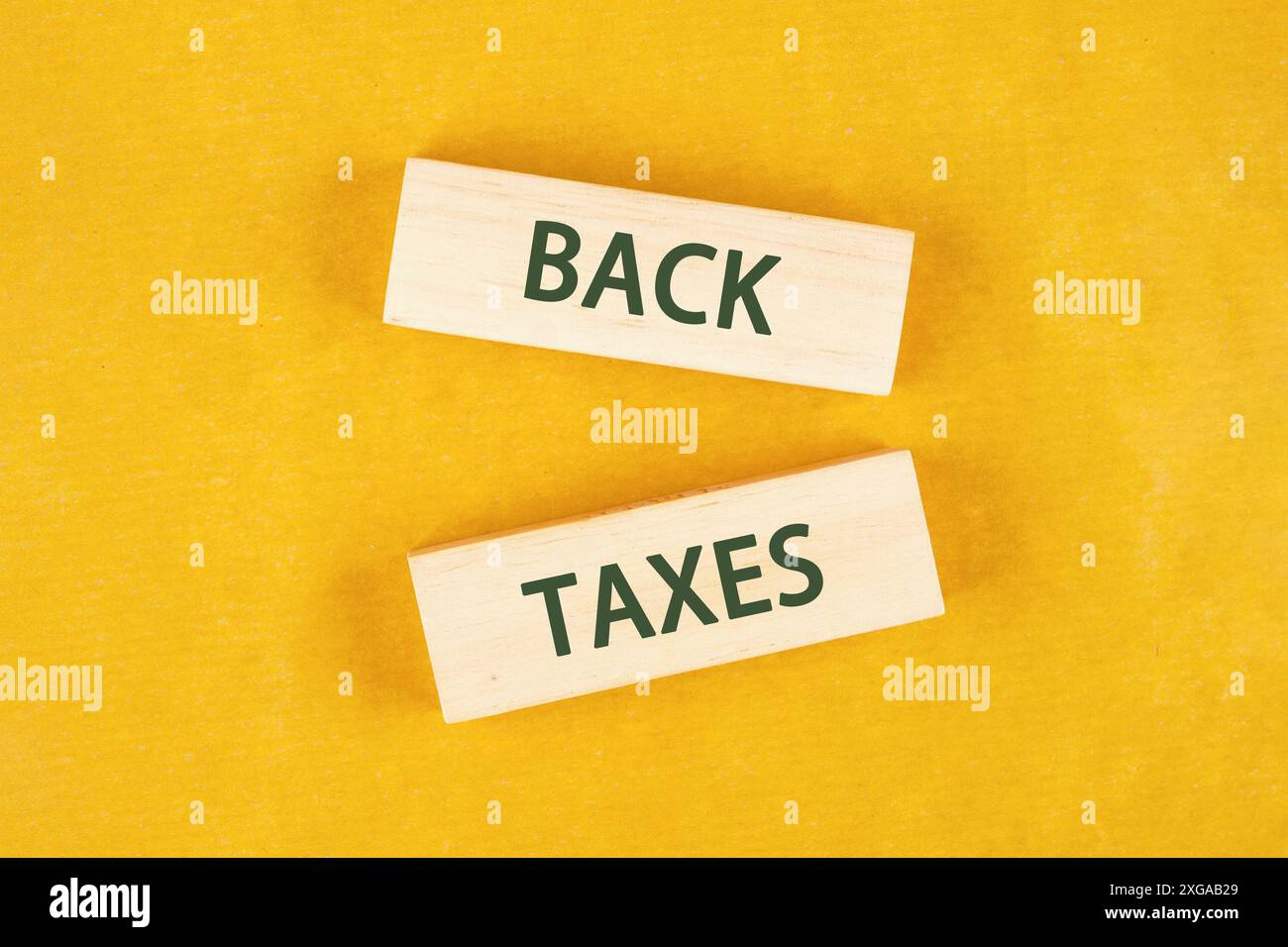 Business and back taxes concept. BACK TAXES symbol on wooden blocks on ...