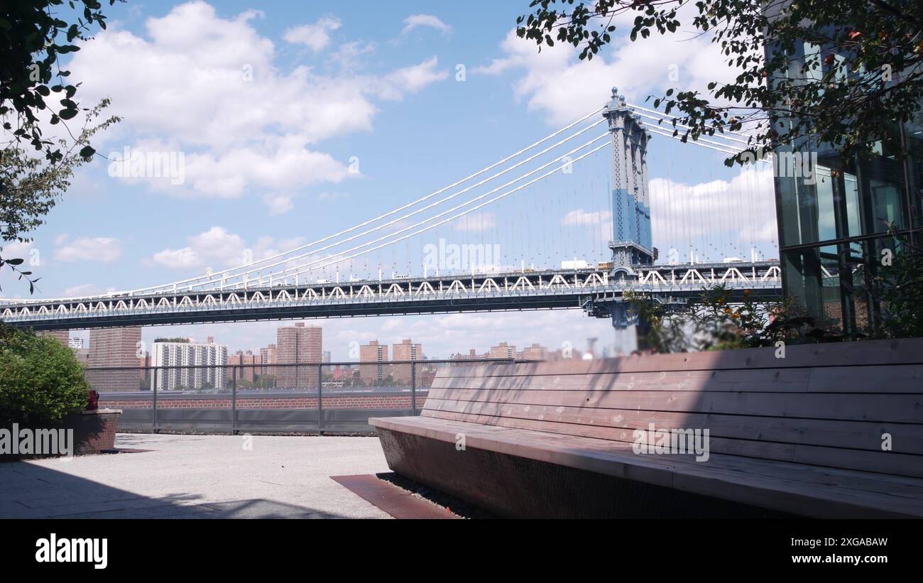 New York City Manhattan Bridge to Brooklyn Dumbo. Bench on waterfront ...