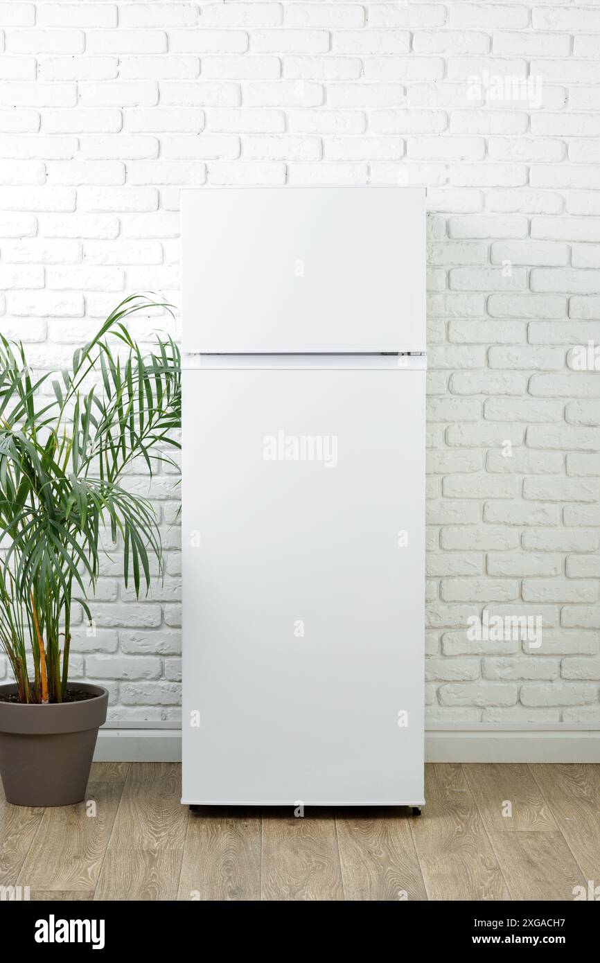 White Refrigerator In A Modern Kitchen With Brick Wall Stock Photo - Alamy