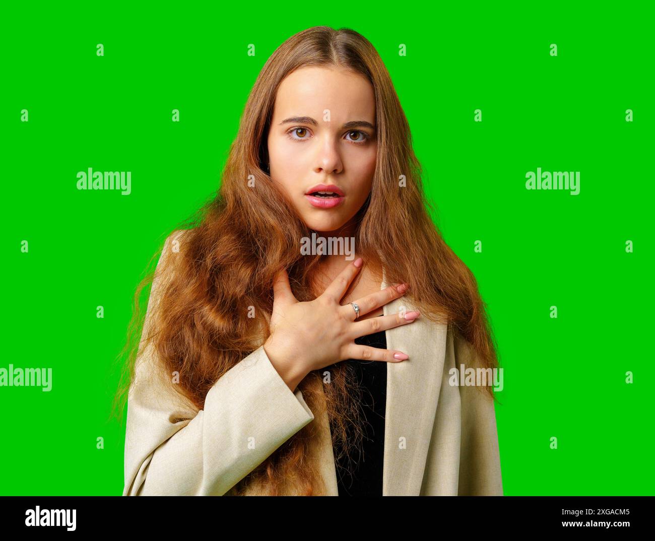 Young Woman Making a Surprised Face in Front of Green Screen Stock Photo - Alamy