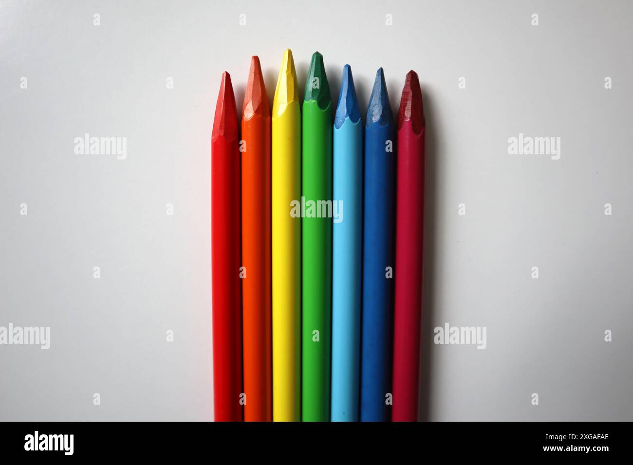 Photo of colored pencils on a white background. Arranged in a color ...