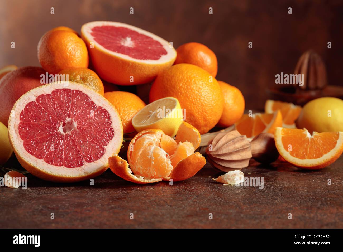 Citrus fruits on a old brown table. Presented are oranges, grapefruits ...