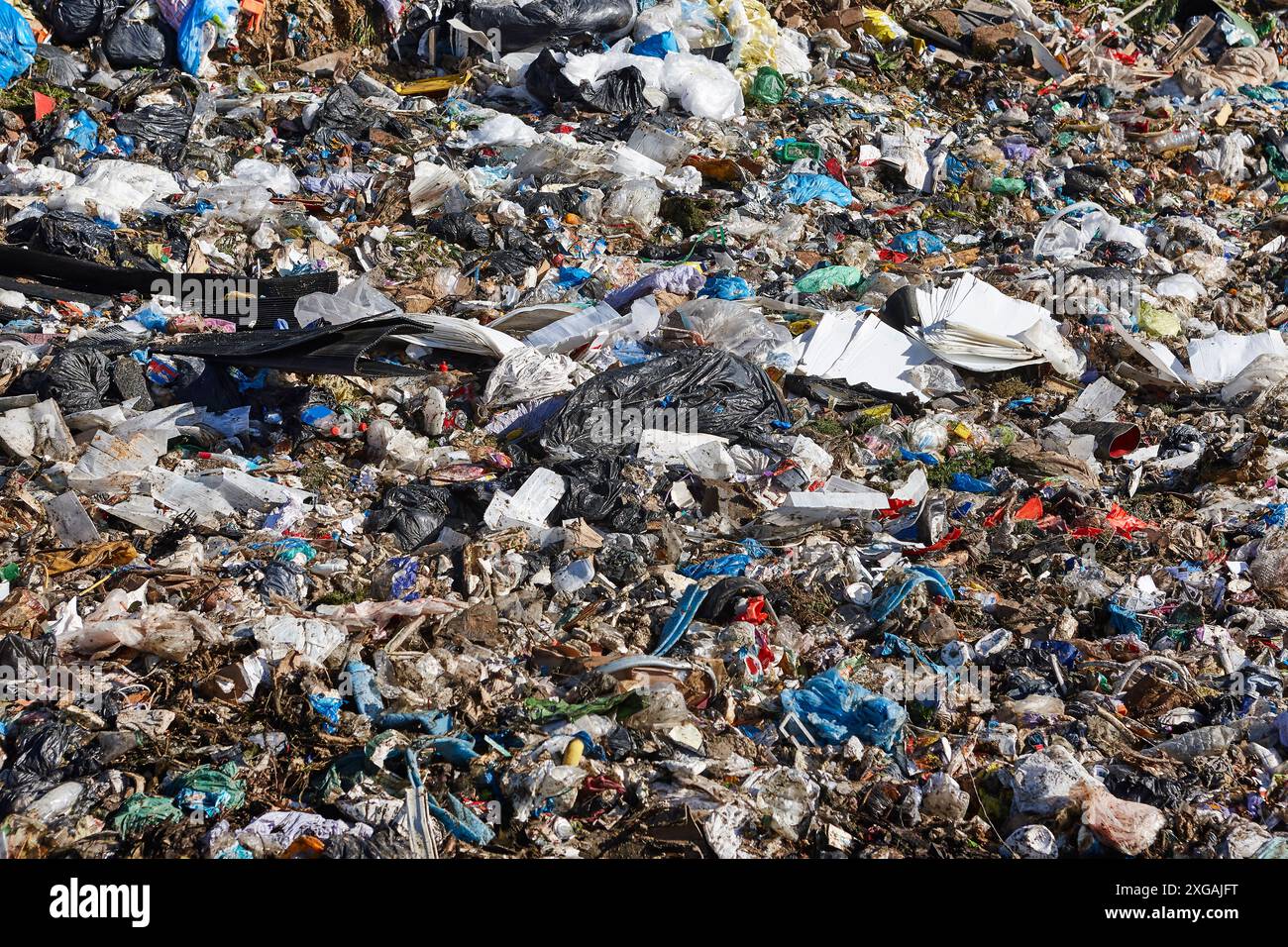 Open air garbage dump. Plastic pollution. Recycling junk. Consumerism ...