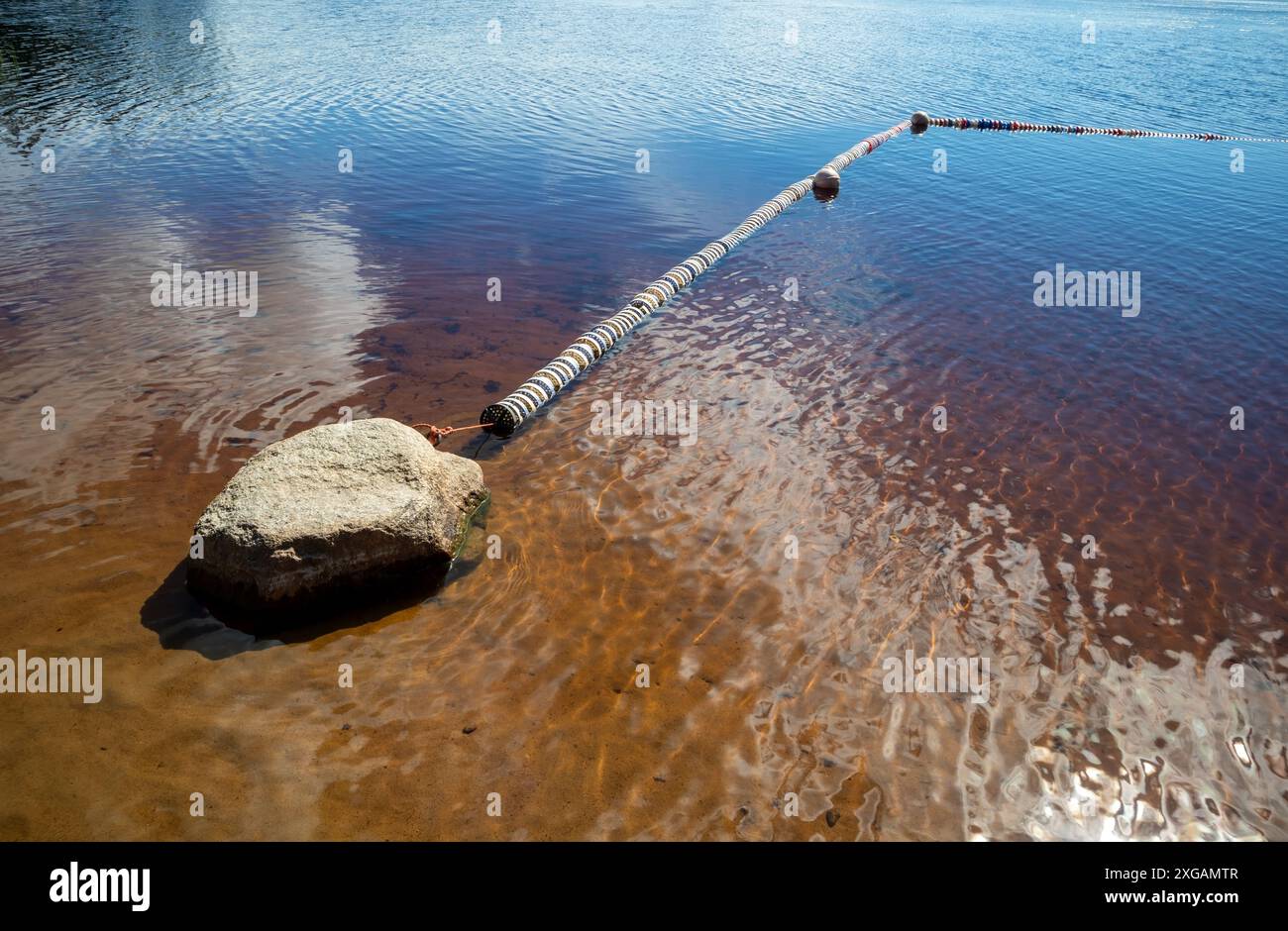 floating barrier line on shallow lake beach Stock Photo - Alamy