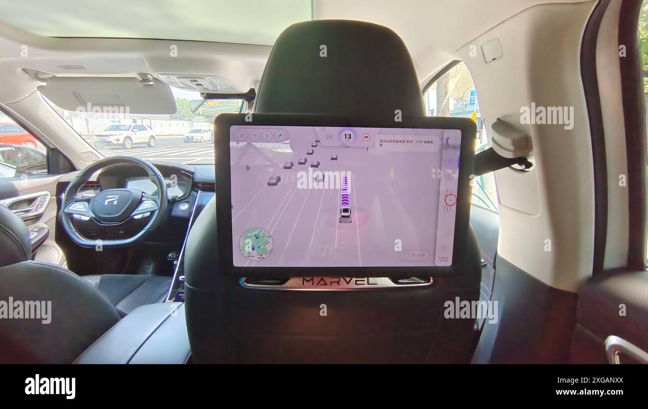 SHANGHAI, CHINA - JULY 7, 2024 - People test a driverless taxi at the ...