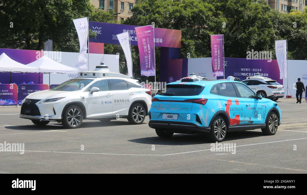SHANGHAI, CHINA - JULY 7, 2024 - People test a driverless taxi at the ...