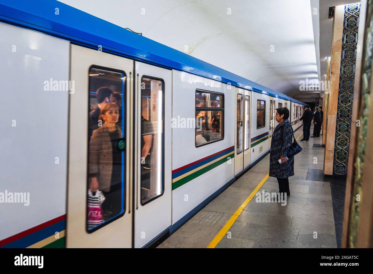 station in the underground Tashkent metro with a train. Tashkent ...