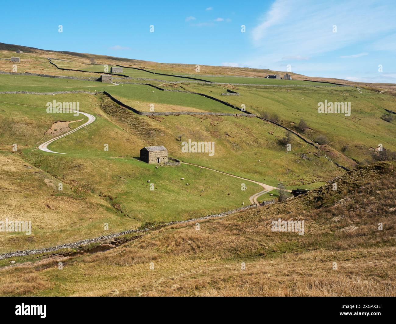 Old stone barns and dry stone walls at High Frith with moorland on ...