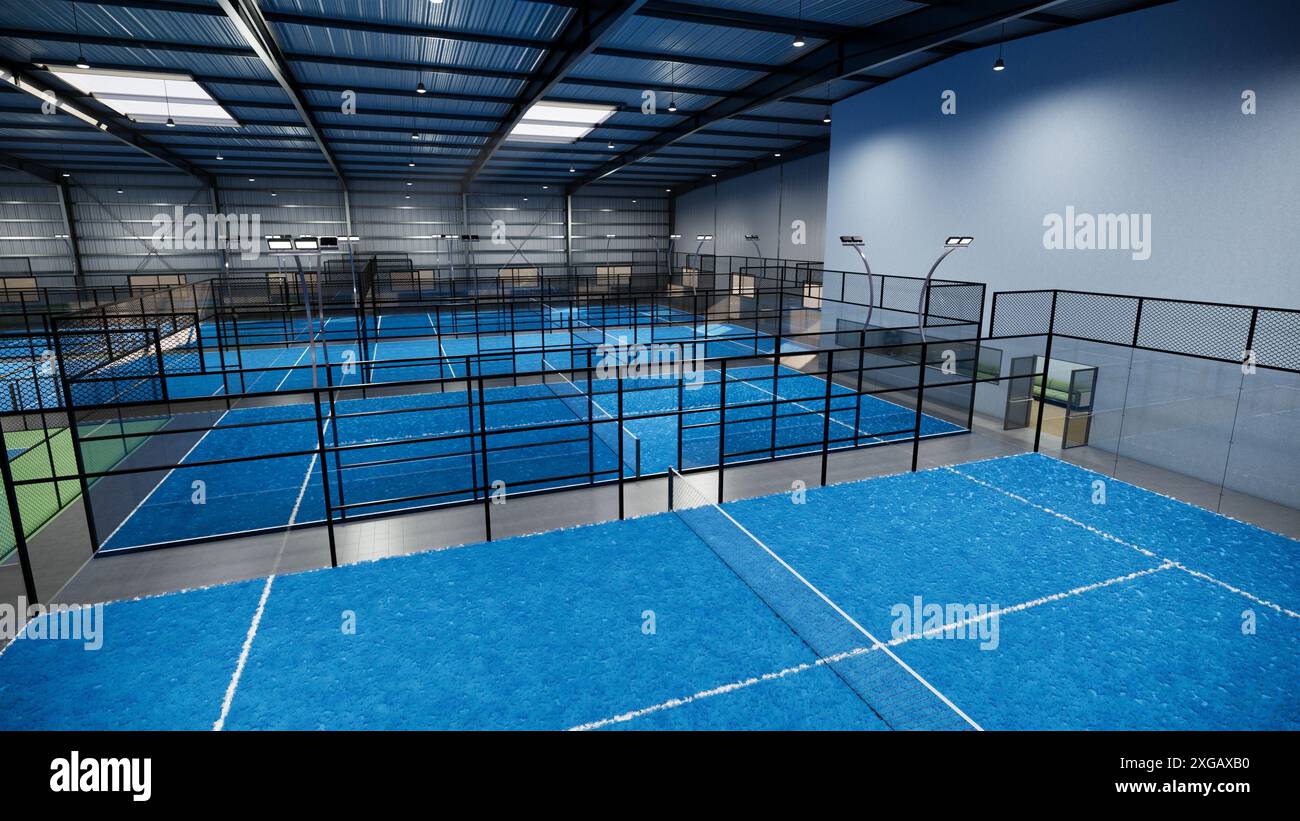 A blue padel tennis court with a blue net Stock Photo - Alamy