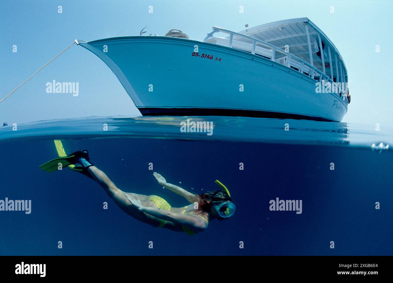 snorkeling near a yacht, split image, Maldives Island, Indian Ocean ...