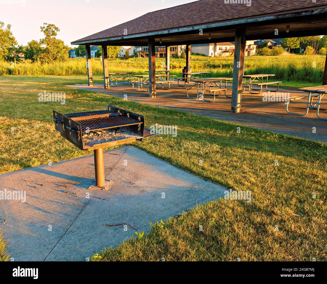 this pavilion has a public grill all ready for the days visitors to ...