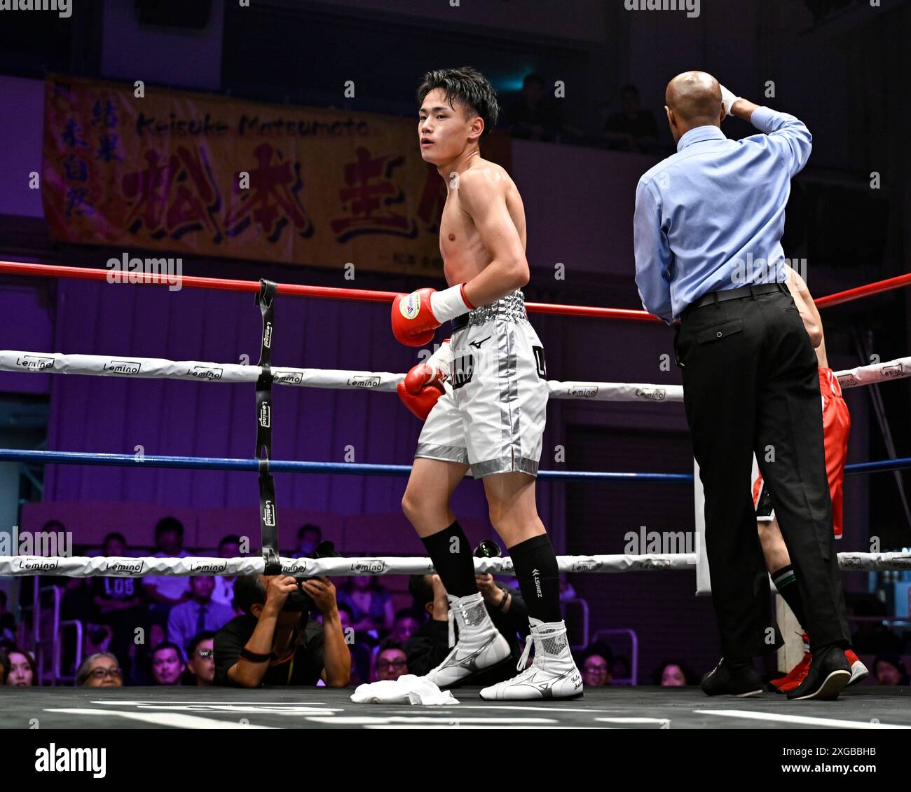 Tokyo, Japan. 25th June, 2024. Japan's Yuta Sakai, left, reacts to his ...