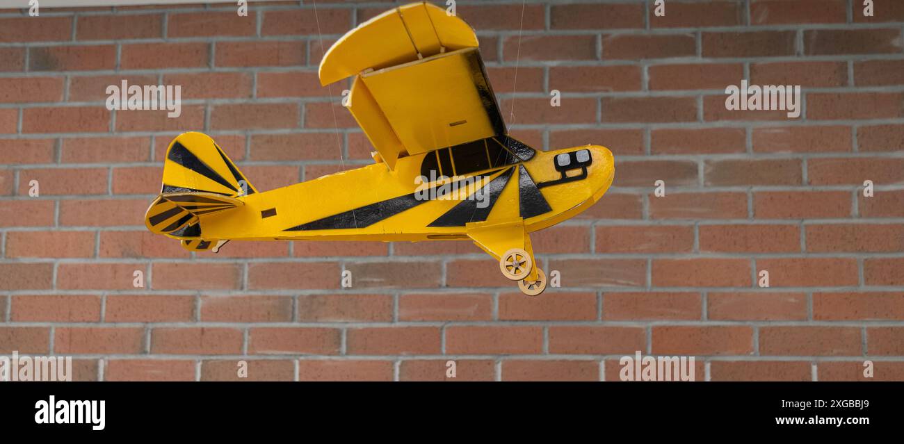 wooden yellow airplane hanging from the ceiling Stock Photo - Alamy