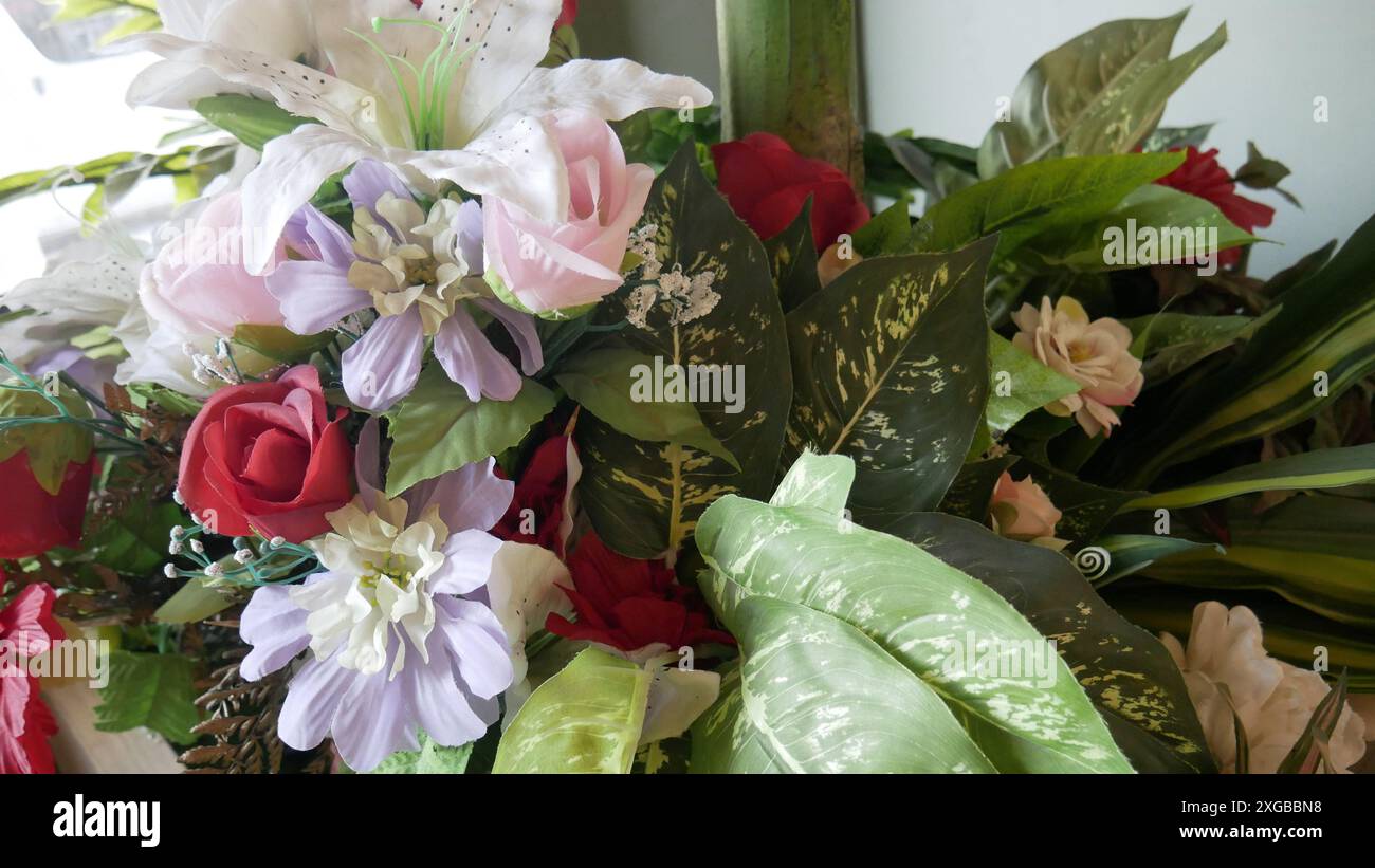 synthetic flowers that resemble real flowers for room decoration. Photo ...