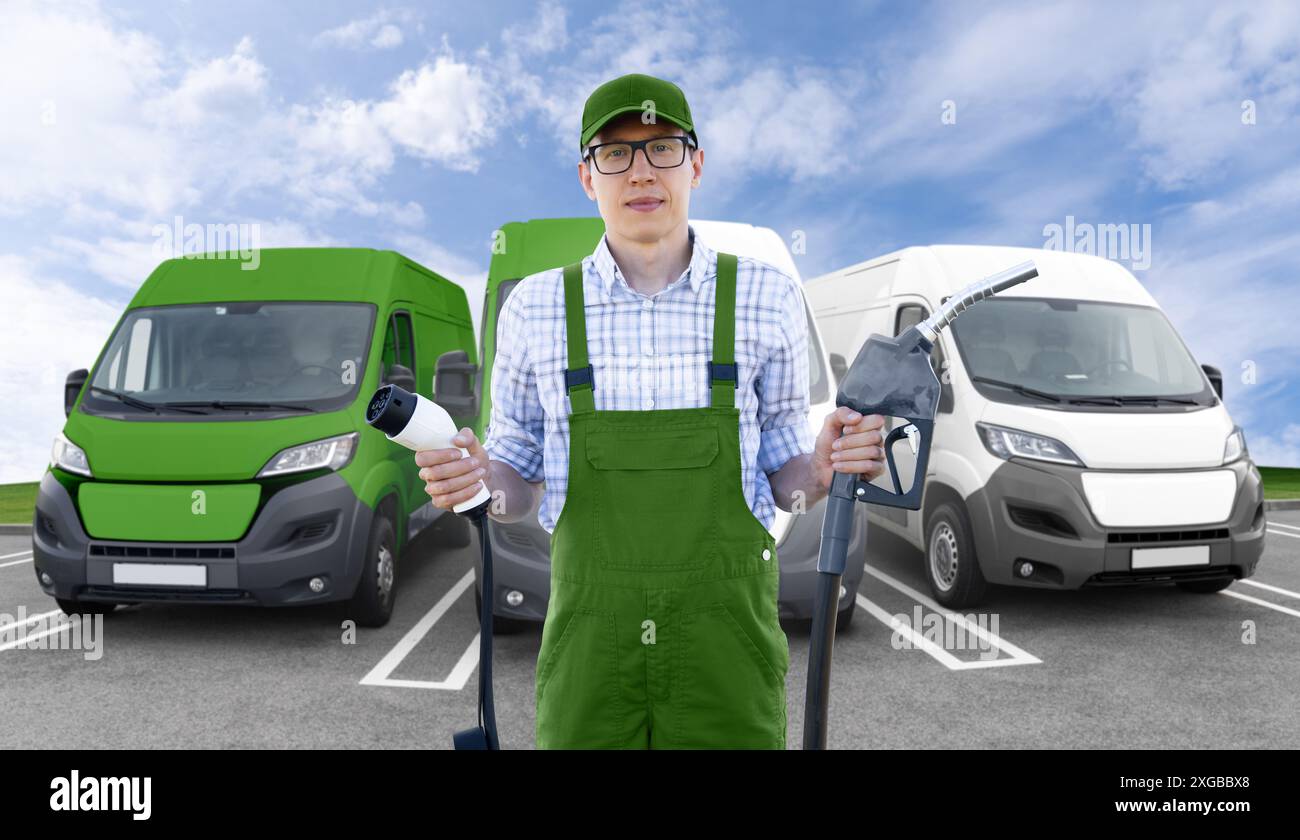 Man wearing green driver uniform holds electric vehicle charging plug ...
