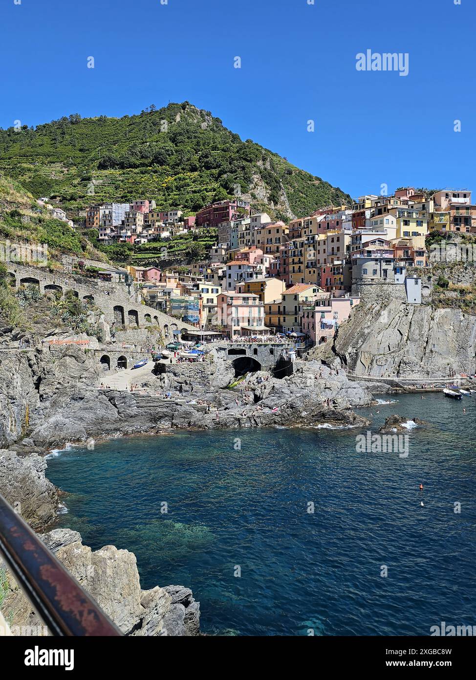 Distant view of Manarola seen from the seaside. Vertical photo with ...