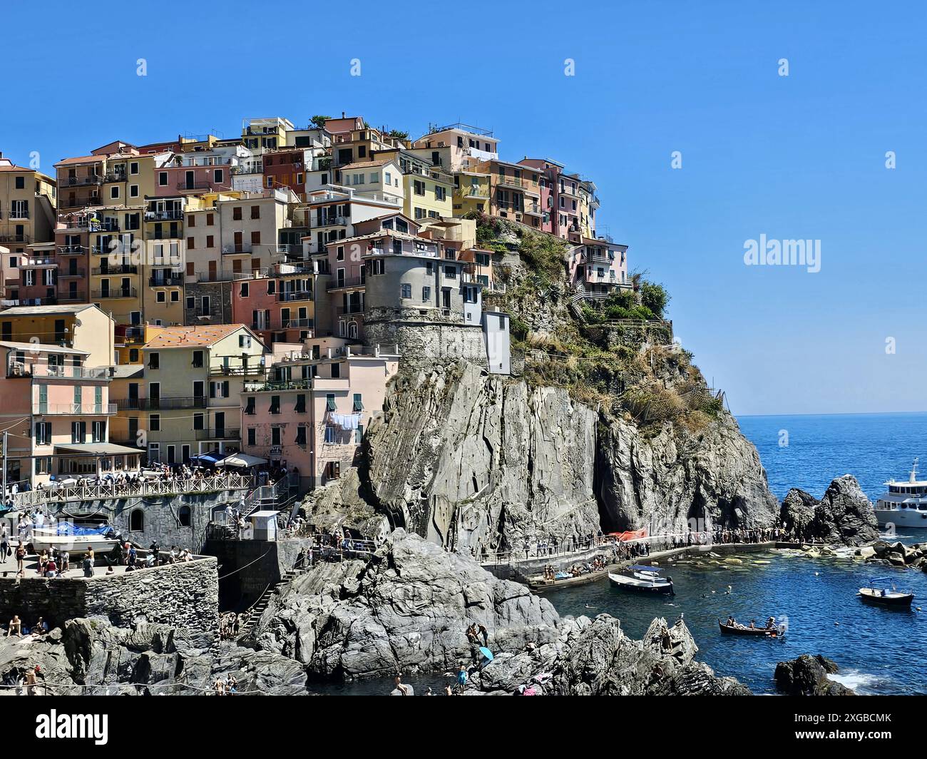 Manarola seen from coastal walking path. Vertical photo Stock Photo - Alamy