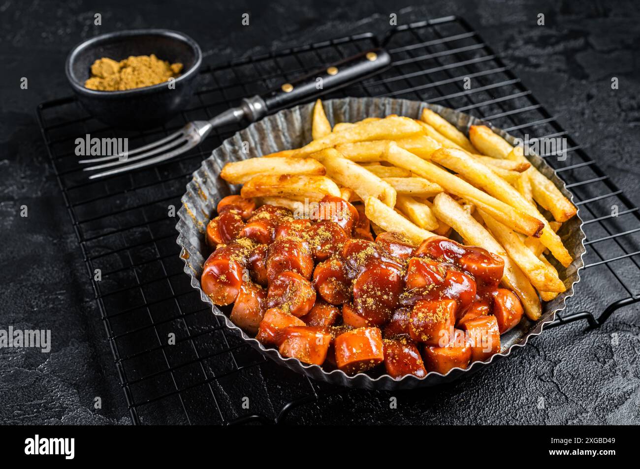 German fastfood currywurst meal, curry wurst with french fry. Black ...