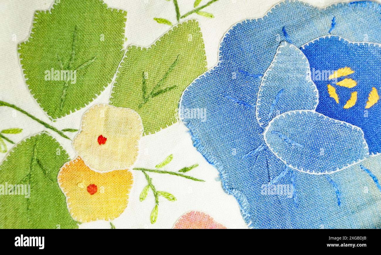 Fabrics and textiles with embroidery and prints of shapes and colors ...