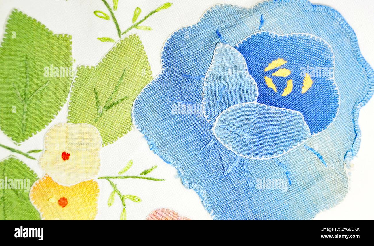 Fabrics and textiles with embroidery and prints of shapes and colors ...