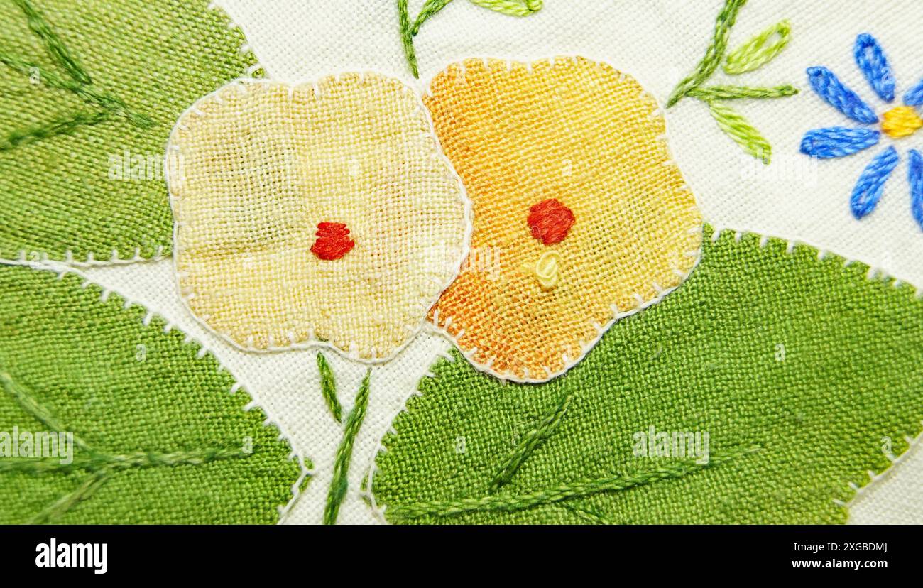 Fabrics and textiles with embroidery and prints of shapes and colors ...