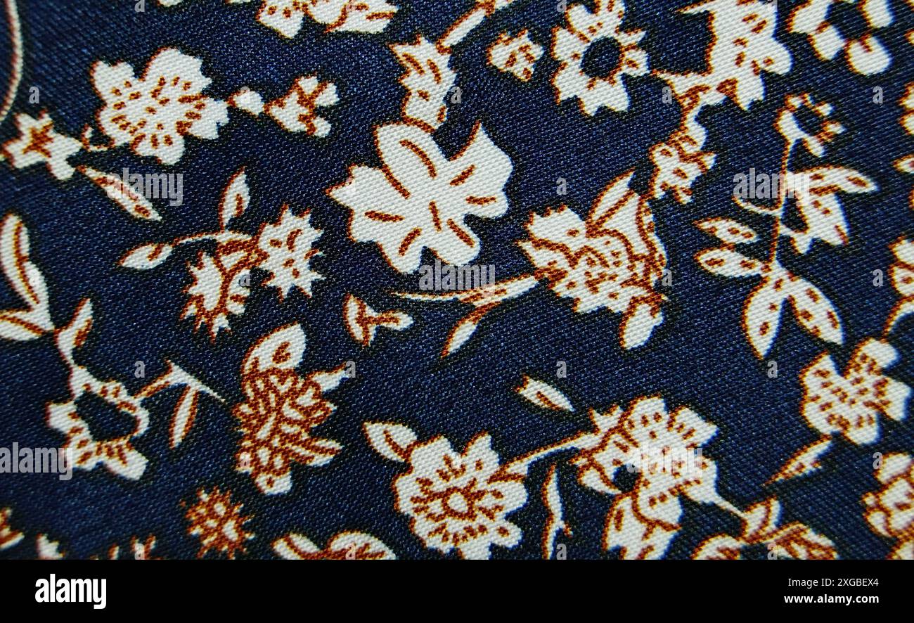 Fabrics and textiles with embroidery and prints of shapes and colors ...