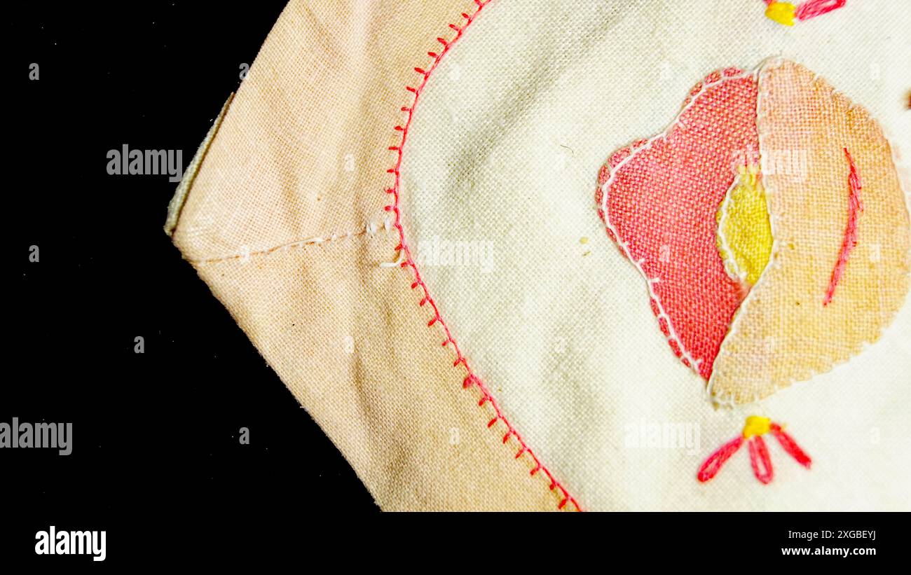 Fabrics and textiles with embroidery and prints of shapes and colors ...
