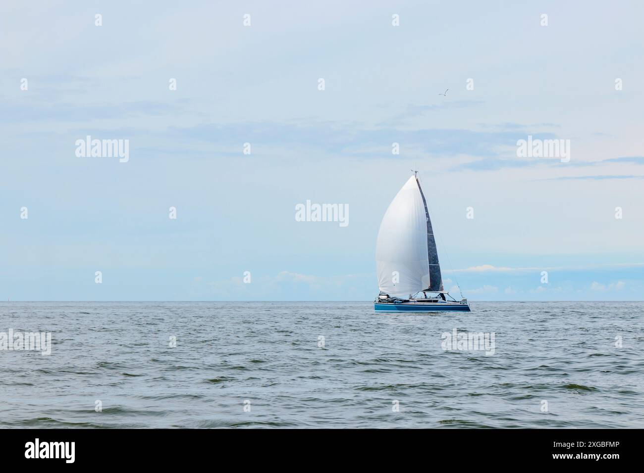 Yacht sailing at waves of the open sea. Nautical landscape with ...