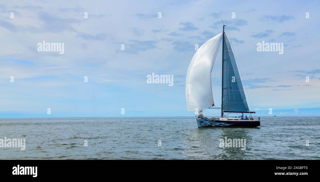 Yacht sailing at waves of the open sea. Nautical landscape with ...