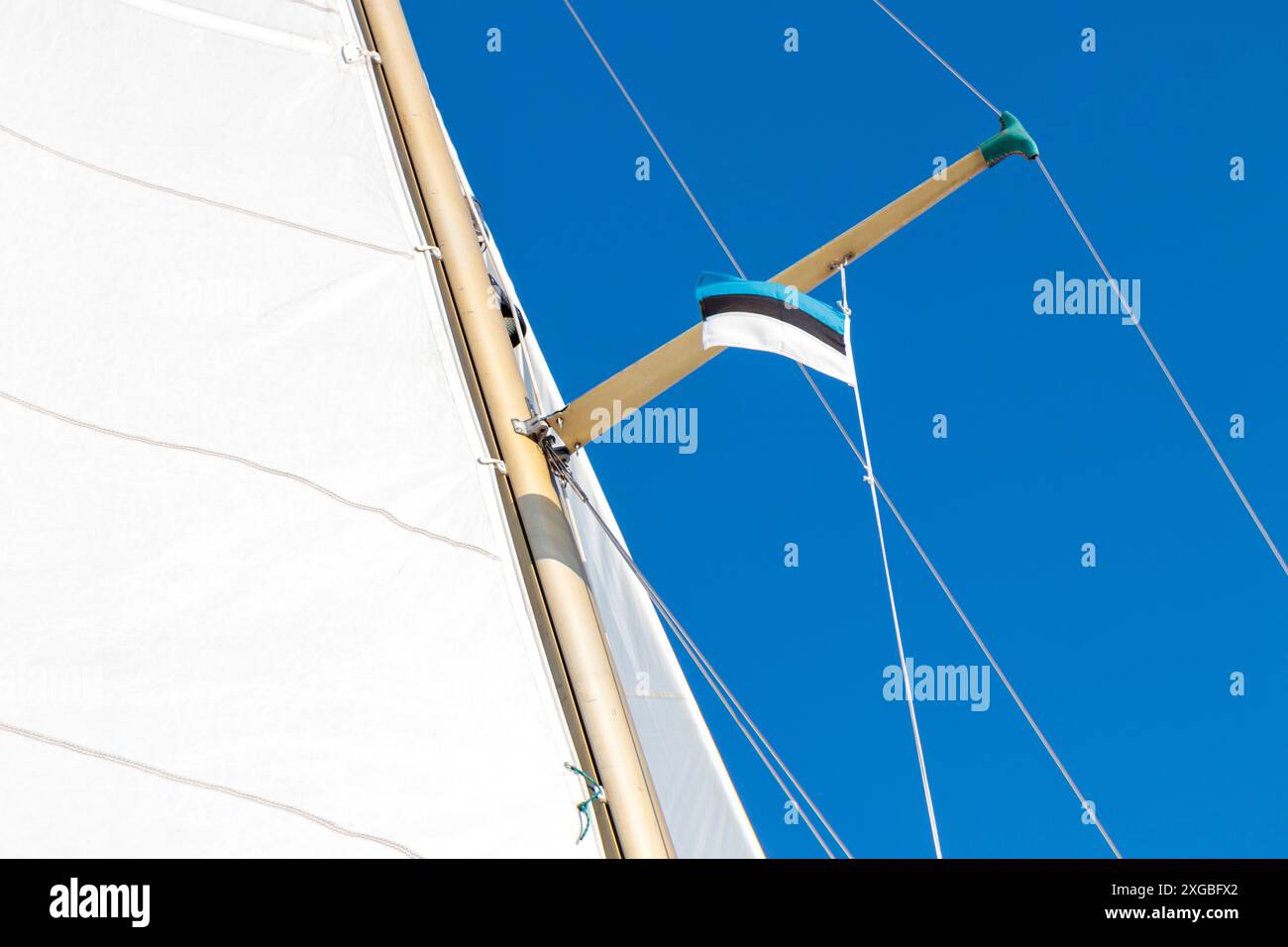Estonian flag on yacht on a shroud under spreader. White and blue ...