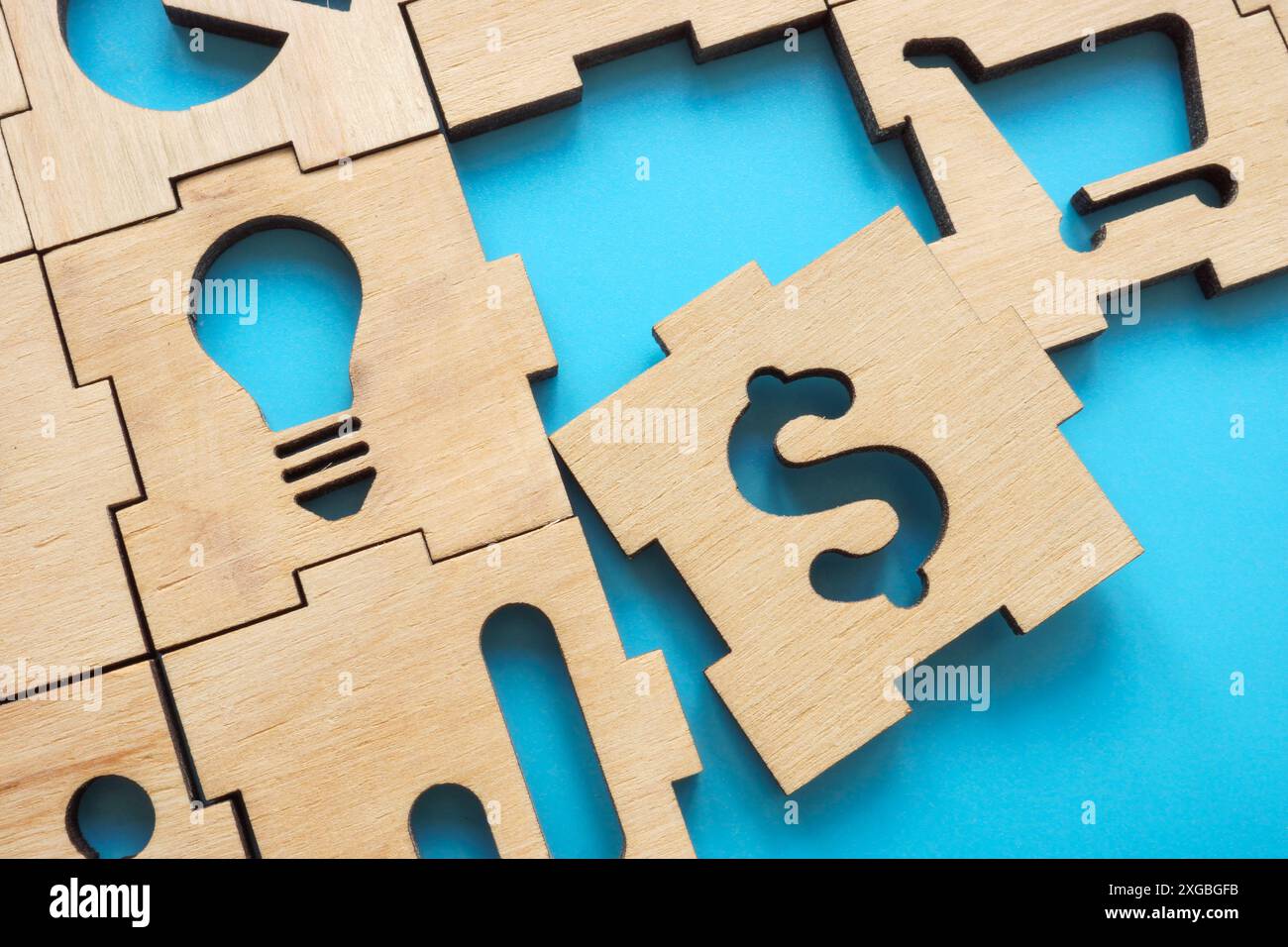 Financial puzzle with dollar sign and light bulb as new ideas in ...