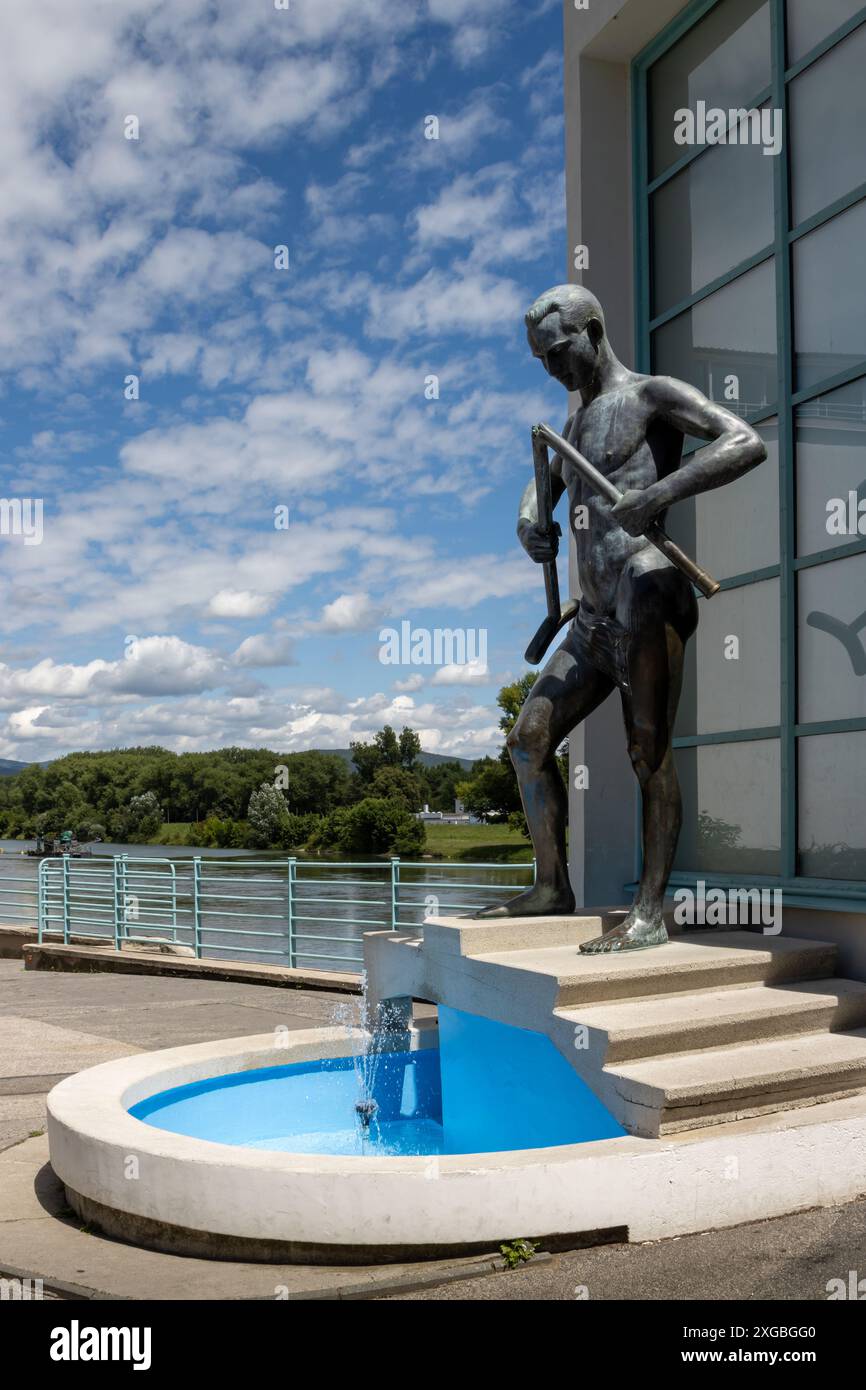 Statue at the entrance on Colonnade Bridge. Man breaking the crutch, as ...