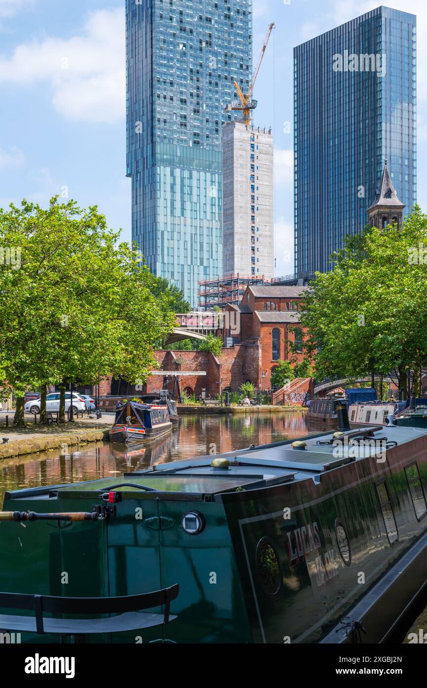 Black barge, lift bridge and trees at Castlefield Bridgewater Canal ...