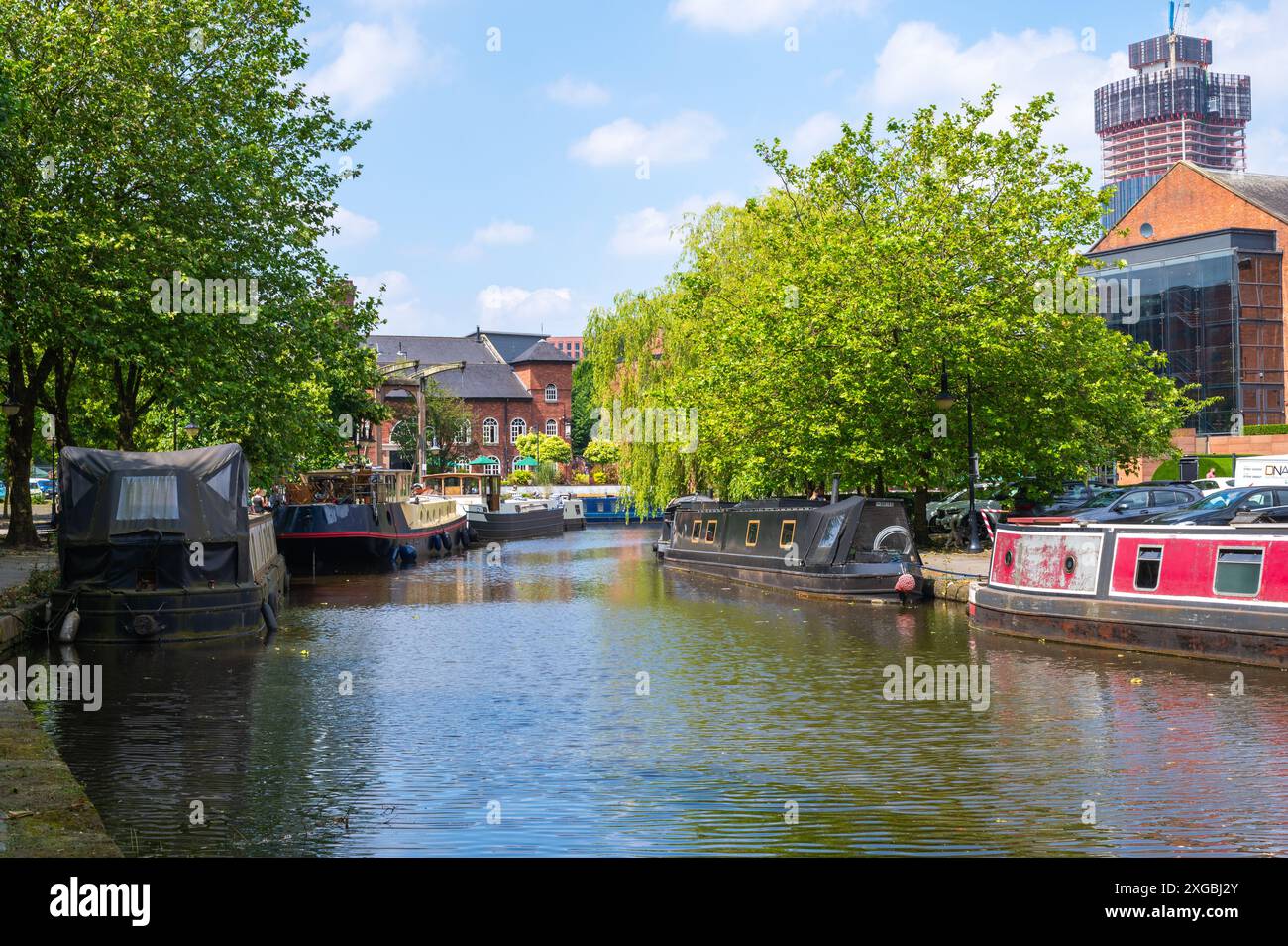 Black barge, lift bridge and trees at Castlefield Bridgewater Canal ...