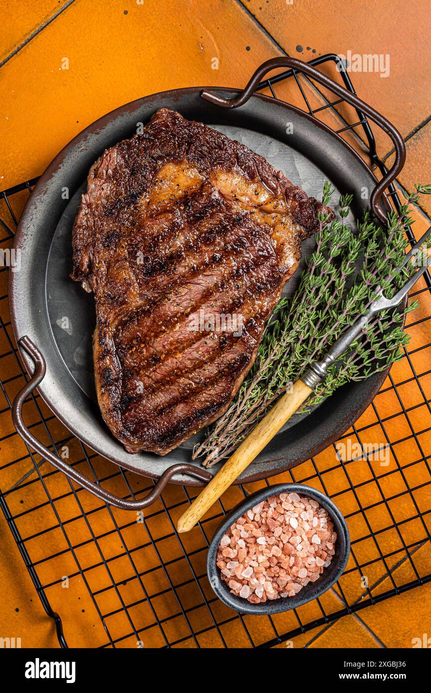 BBQ Grilled wagyu Rib Eye beef meat steak with herbs in steel tray ...