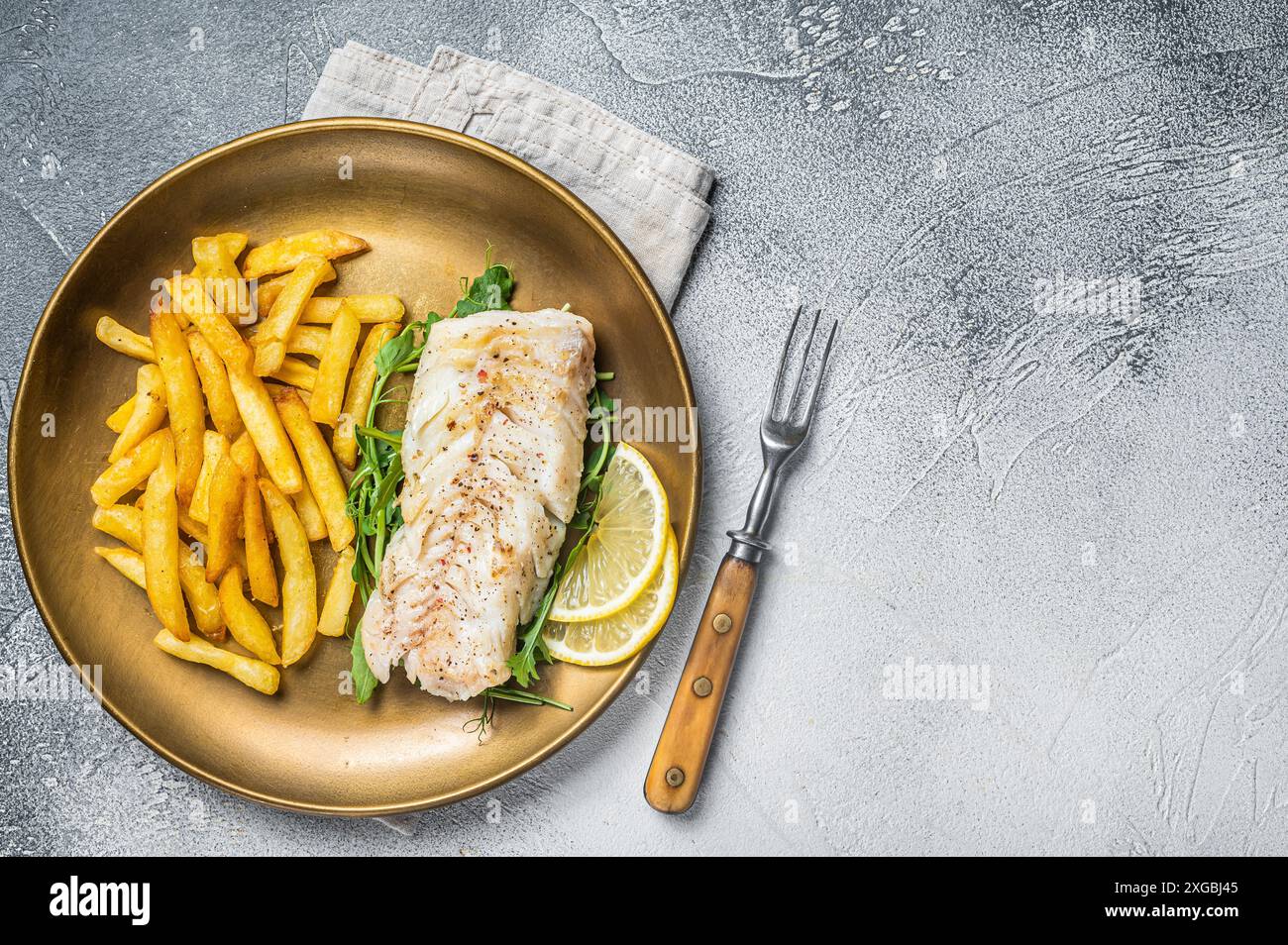 Fried cod fish fillet served with french fries. White background. Top ...