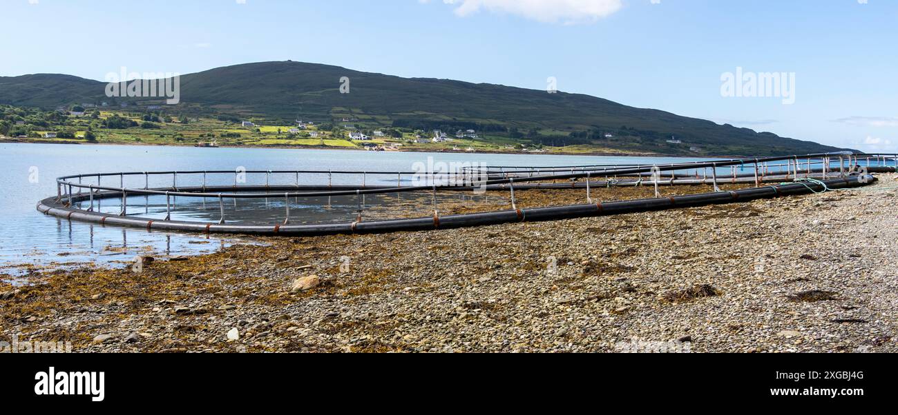 Fish Farm Pen dragged up onto shingle beach Stock Photo - Alamy
