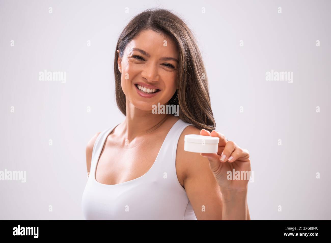 Portrait of adult woman who is holding skin cream Stock Photo - Alamy