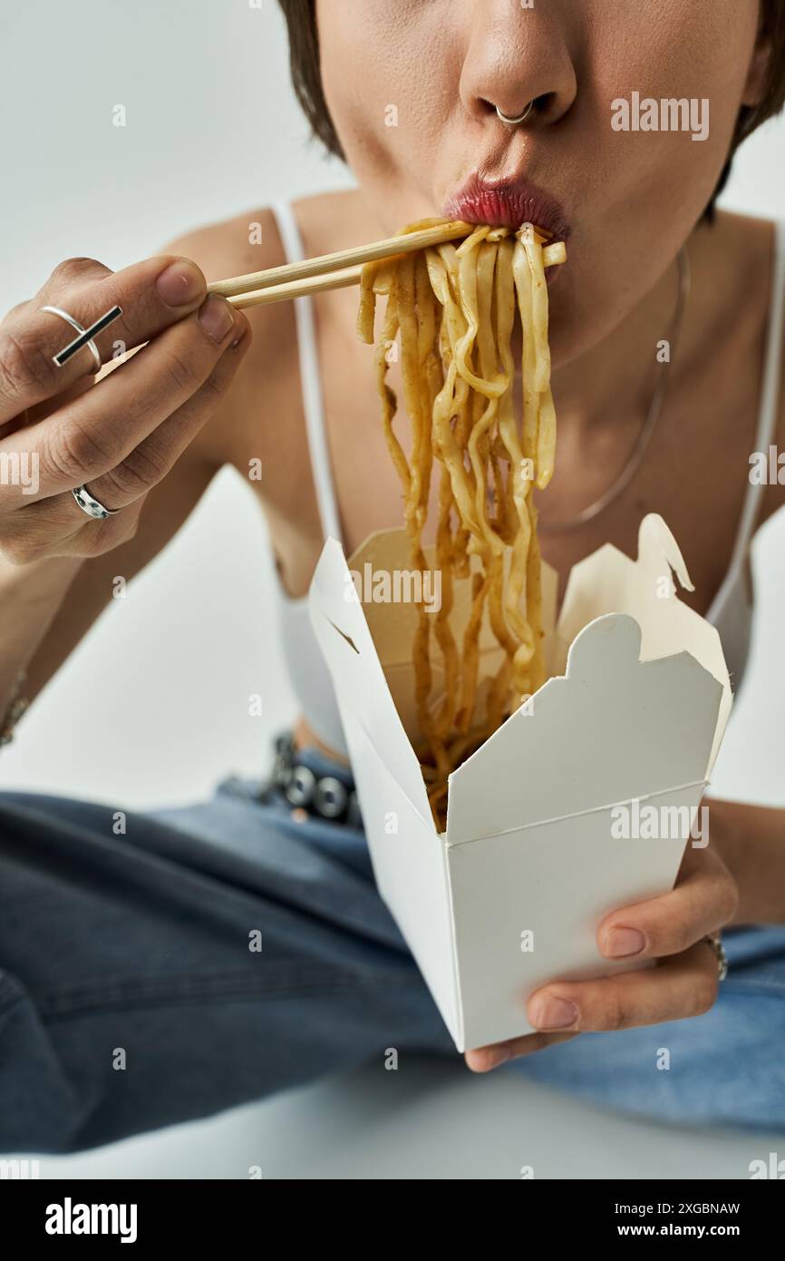 Beautiful woman eating chopsticks hi-res stock photography and images ...