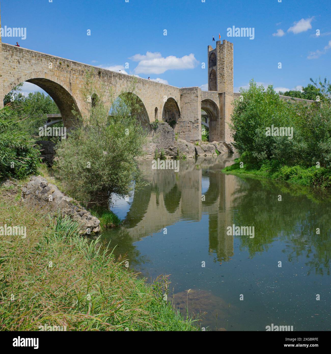 Girona, Spain - 7 July, 2024: Reflections of the medieval Pont Vell ...
