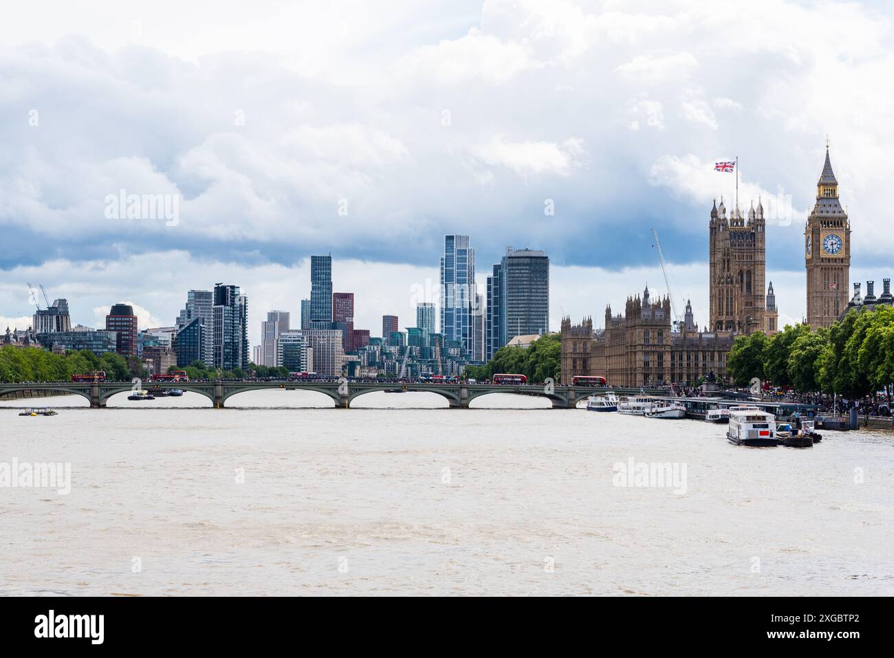 London with red London buses crossing Westminster Bridge. Vauxhall and ...