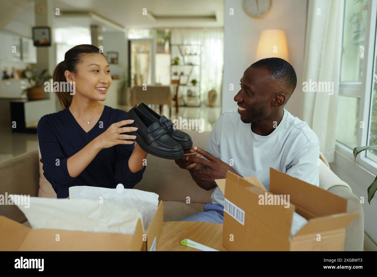 Young couple showing shoes hi-res stock photography and images - Alamy