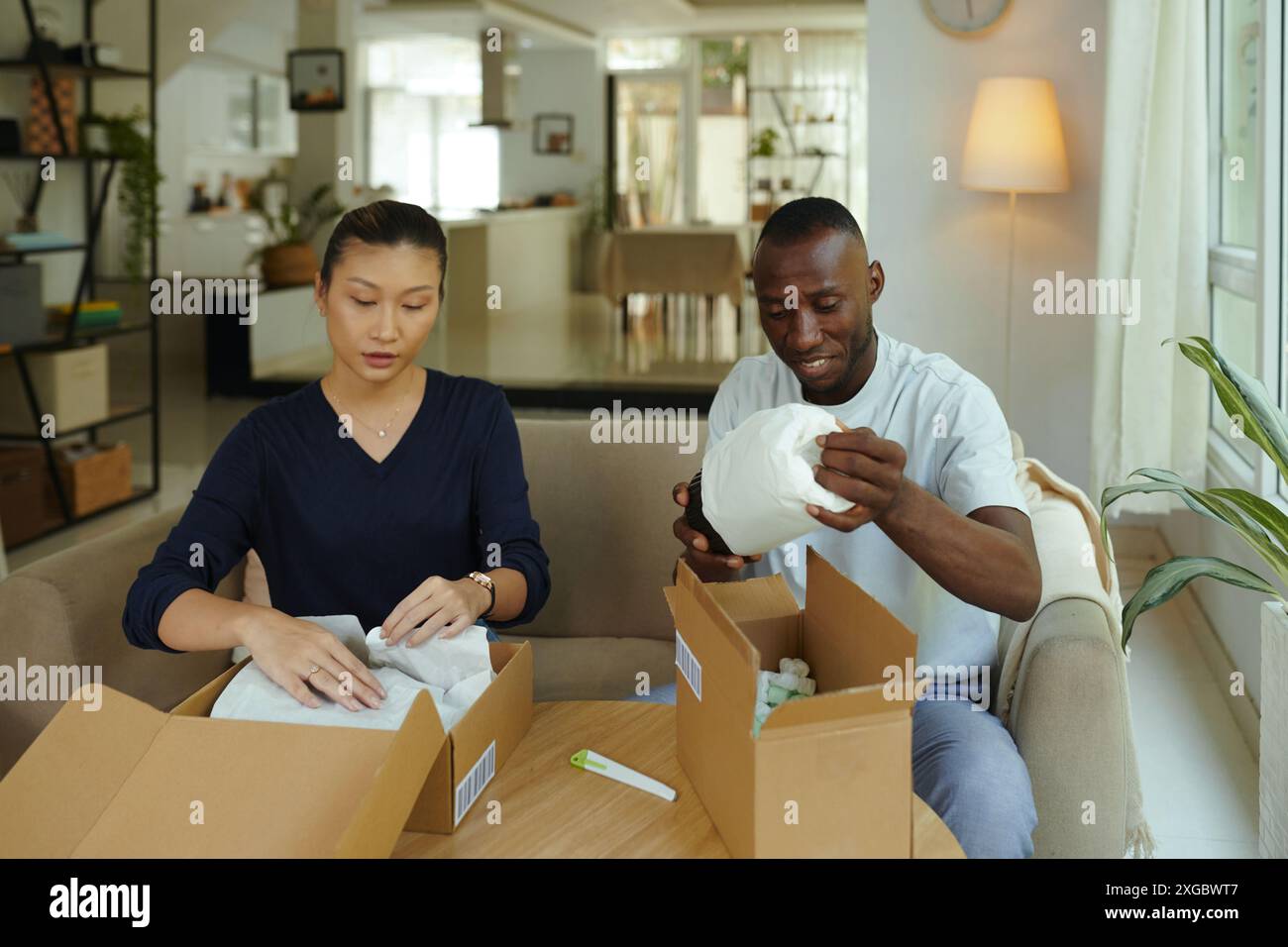 African man unpacking store hi-res stock photography and images - Alamy