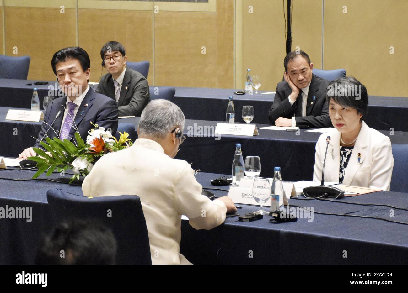 Japanese Foreign Minister Yoko Kamikawa (far R) and Defense Minister ...